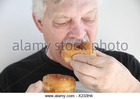 ELDERLY PERSON EATING SWEETS Stock Photo: 48412225 - Alamy