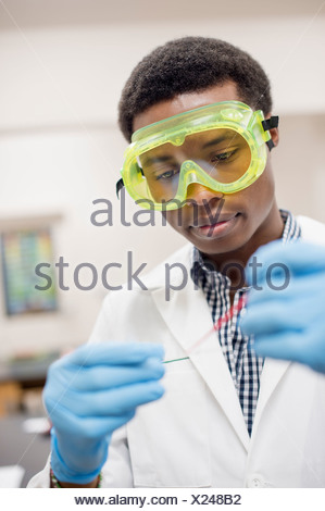 Male student wearing safety goggles Stock Photo: 11729625 - Alamy