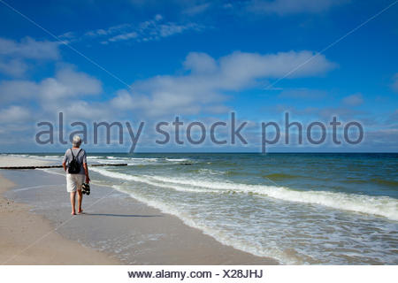 People walking along a stormy beach, Sylt, North Sea Coast, Schleswig ...