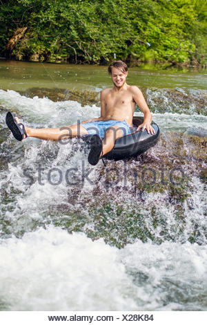Man floating down river on inner tube in Central Florida USA Stock ...