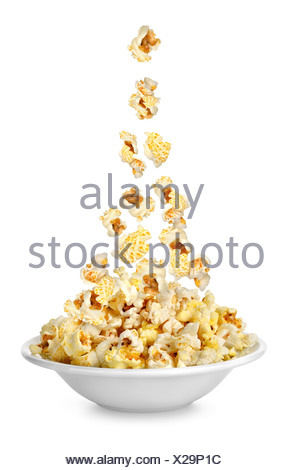 Popcorn falling in the plate. Isolated on white background Stock Photo ...