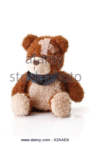 Teddy bear with band-aids on its head Stock Photo - Alamy