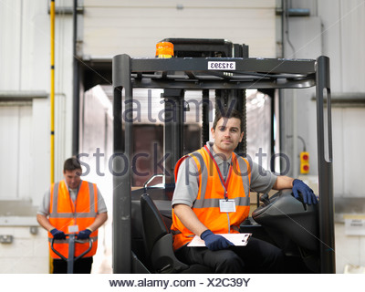 Man sitting with forklift truck, portrait Stock Photo: 50015639 - Alamy
