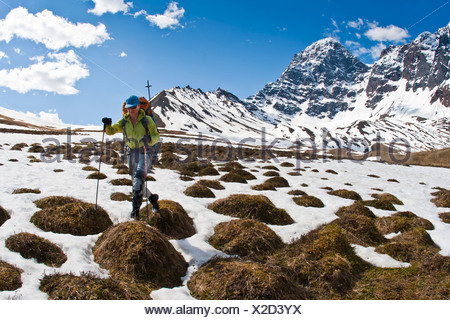 Female backpacker crossing the Babel River below South Buttress on ...
