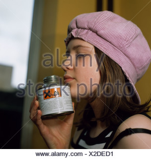 Teenage girl sniffing glue to get high Stock Photo: 30322231 - Alamy