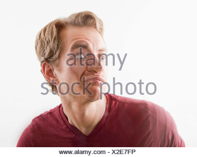 Man pushing his face against glass Stock Photo - Alamy