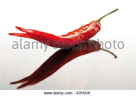 Cut open red chilli pepper Stock Photo - Alamy