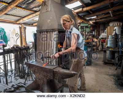 Female blacksmith working in workshop Stock Photo: 104722330 - Alamy