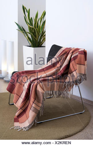 Throw draped over a chair Stock Photo: 18941856 - Alamy