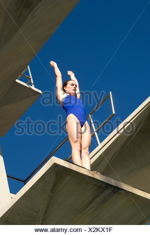 Female swimmer standing on diving board Stock Photo: 26801065 - Alamy