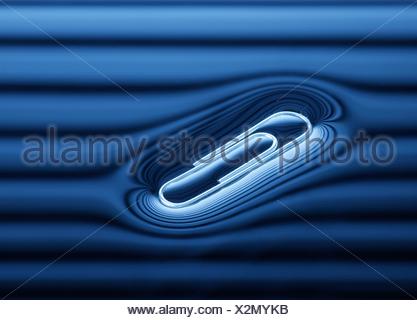 Floating Paperclip. Paper clip floating on water courtesy of surface ...