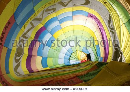man inside hot air balloon as it inflates Stock Photo: 52266644 - Alamy