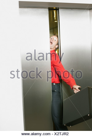 People in elevator, doors closing Stock Photo: 8504289 - Alamy