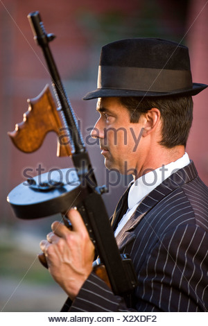 Profile of gangster holding Tommy gun Stock Photo: 28516621 - Alamy