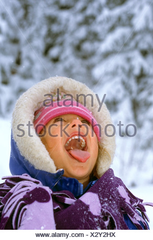 Young Girl Catching Snowflakes on Tongue SC AK Winter Stock Photo ...