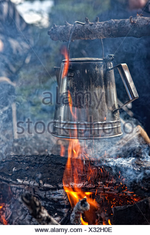Kettle Boiling over open fire In The woods Stock Photo: 89205492 - Alamy