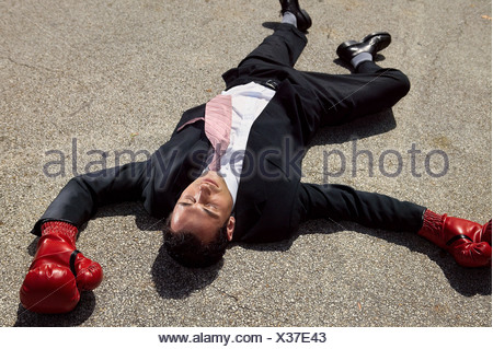 Unconscious Man Lying On Concrete Street After Accident With An ...