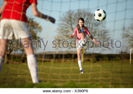soccer football player striking ball at goal Stock Photo - Alamy