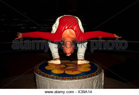One flexible lady circus woman bending body contortionist posing Stock ...