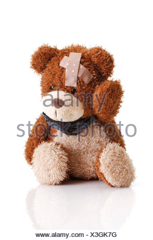 Teddy bear with band-aids on its head Stock Photo - Alamy