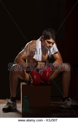 Boxer sitting on stool corner of boxing ring Stock Photo - Alamy
