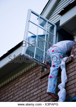 teenager climbing out of her bedroom window Stock Photo - Alamy