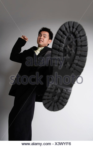 business man ready to stomp Stock Photo: 26020645 - Alamy
