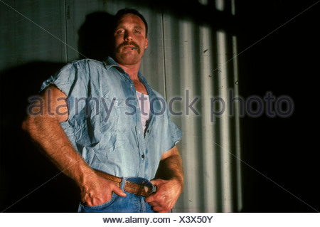 A prisoner smoking a cigarette in his prison cell Stock Photo: 20027689 ...