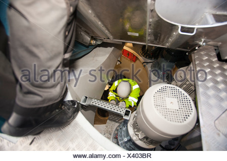 Engineer inside the nacelle of a wind turbine at Caton Moor wind farm ...
