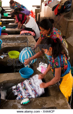 Maya indigenous women wash laundry at the Public Pila of Antigua Stock ...