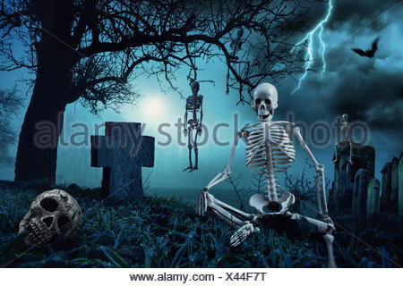 Nighttime Halloween scene with skeletons at a cemetery and the ...