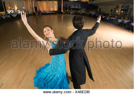 Professional ballroom dancers performing in the Standard Dance Stock ...