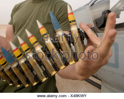 A US Marine Corps Weapons Technician Loads 20mm High Explosive Rounds ...
