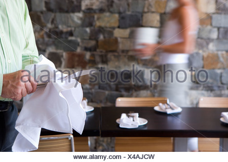 Waiter laying table Stock Photo: 13897281 - Alamy