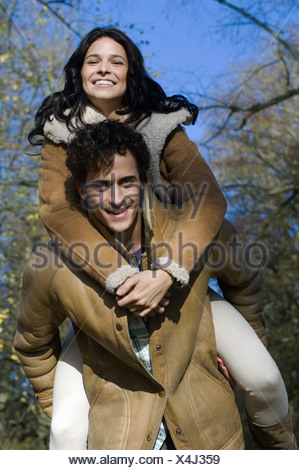 A woman standing on a man's back, obscured faces Stock Photo: 20028004 ...