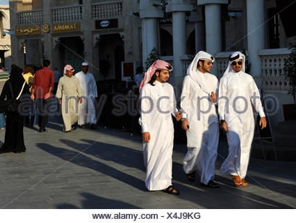 Qatari with ghutrah headdress strolling in the Souq al Waqif, oldest ...