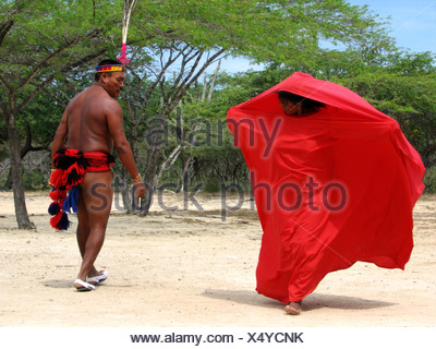 Wayuu indians in traditional clothing dancing a ritual dance on the ...