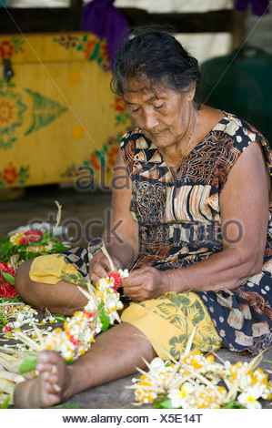 Tuvaluan women creating traditional flower head dresses, Funafuti Stock ...
