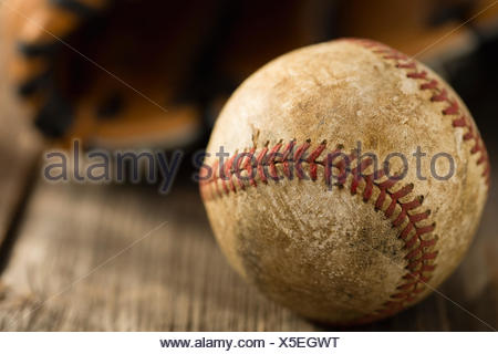 Dirty baseball on wood Stock Photo - Alamy