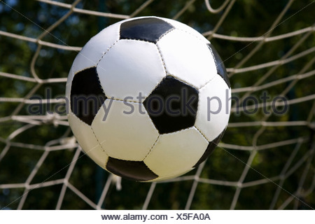Soccer ball going into goal net Stock Photo: 49139666 - Alamy