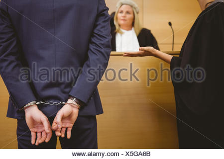 Judge and lawyer listening the criminal in handcuffs Stock Photo ...