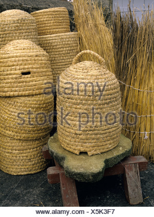 Bee Skep and hives being made from long straw Stock Photo - Alamy