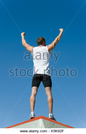 Athletes standing on podiums Stock Photo - Alamy