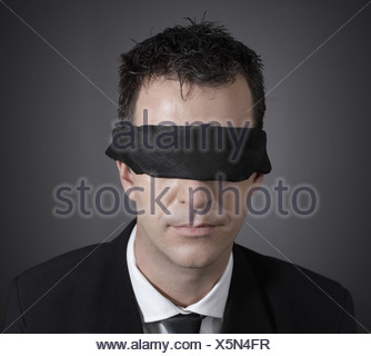 Close-up of a businessman wearing a blindfold Stock Photo: 11366582 - Alamy