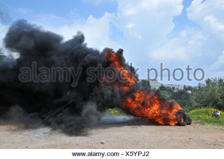 Burning tyres. Tyres are burnt as part of a demonstration to block ...