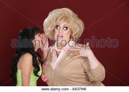 Shocked retro-styled woman with drag queen smoking cigarettes Stock ...