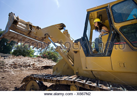 Woman operating bulldozer at a construction site Stock Photo: 16168297 ...
