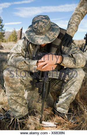 Soldier sitting, looking down Stock Photo: 26813719 - Alamy