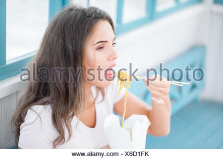 Girl slurping spaghetti noodles Stock Photo: 12870900 - Alamy