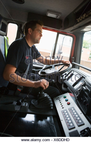 A fireman in the driver's seat of a fire truck in Columbus, Georgia ...